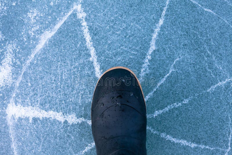 Danger Thin Ice Radially Cracks Under Rubber Boot Stock Photo - Image ...