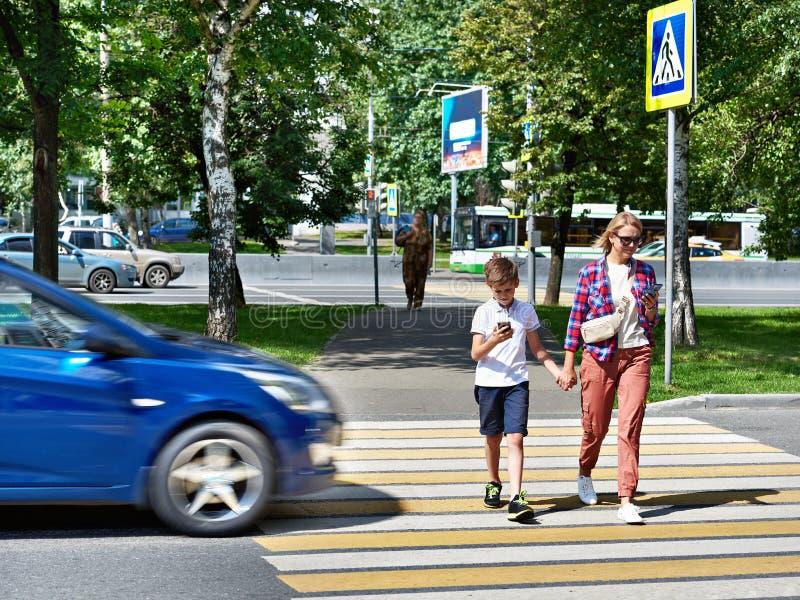 Danger of Using Smartphone by Pedestrians on Road Stock Image - Image ...