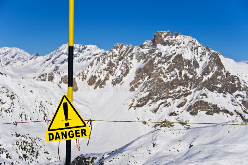 Yellow Danger Sign On Snowy Mountain Stock Photo - Image of downhill ...