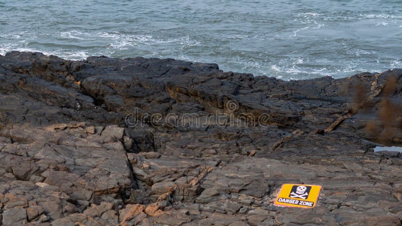 Danger Zone Painted on the Rocks Stock Image - Image of cliff ...