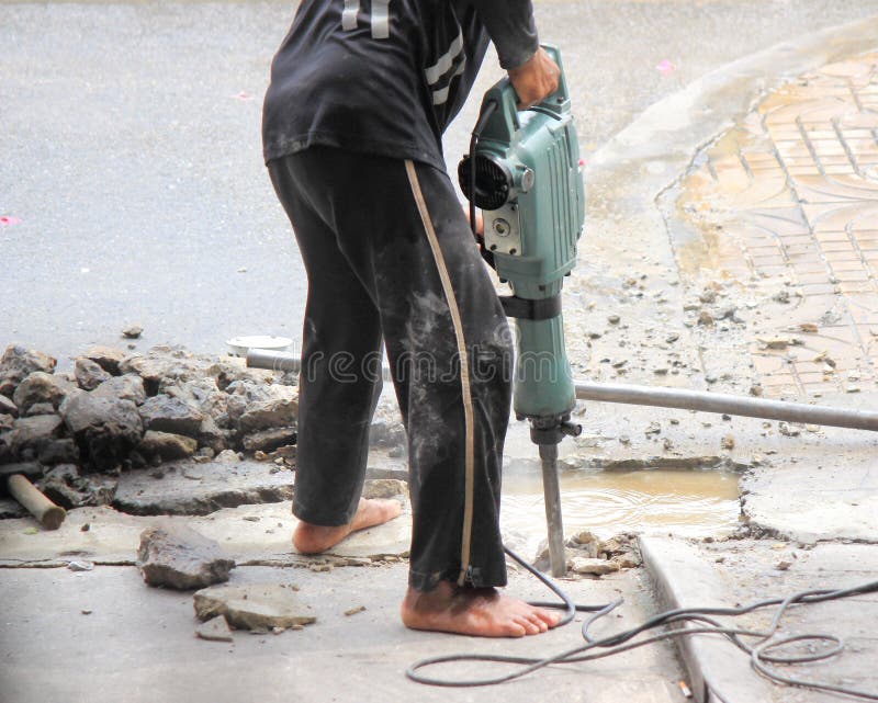 Dangerous Behavior for Drilling Concrete. Stock Photo - Image of ...