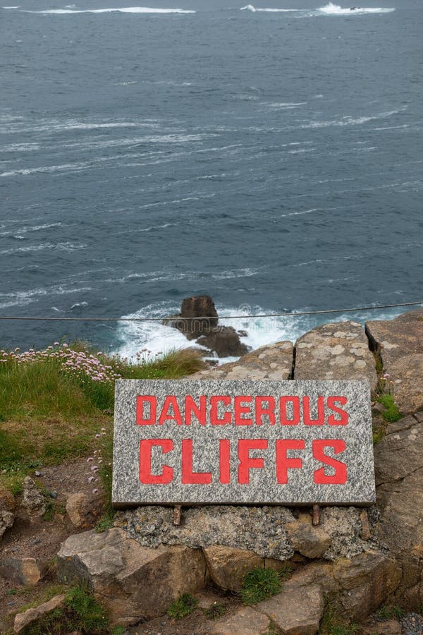Dangerous Cliffs Sign in Red Writing Stock Photo - Image of sign, edge ...