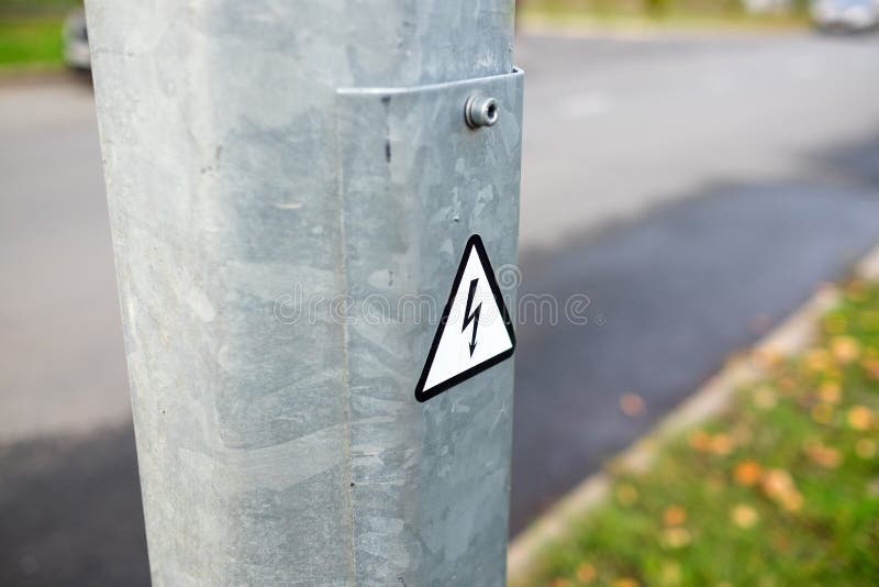Dangerous Electricity Sign on the Post Stock Photo - Image of metallic ...