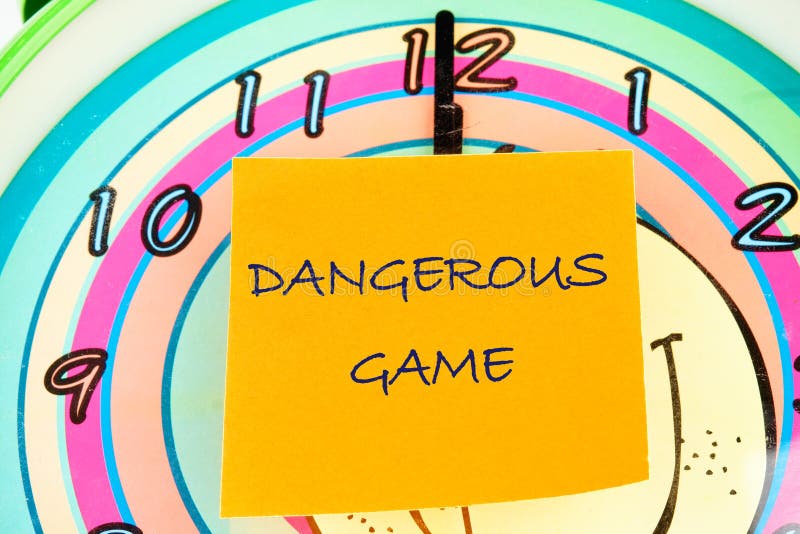DANGEROUS GAME Symbol. Concept Word DANGEROUS GAME on a Yellow Sticker ...