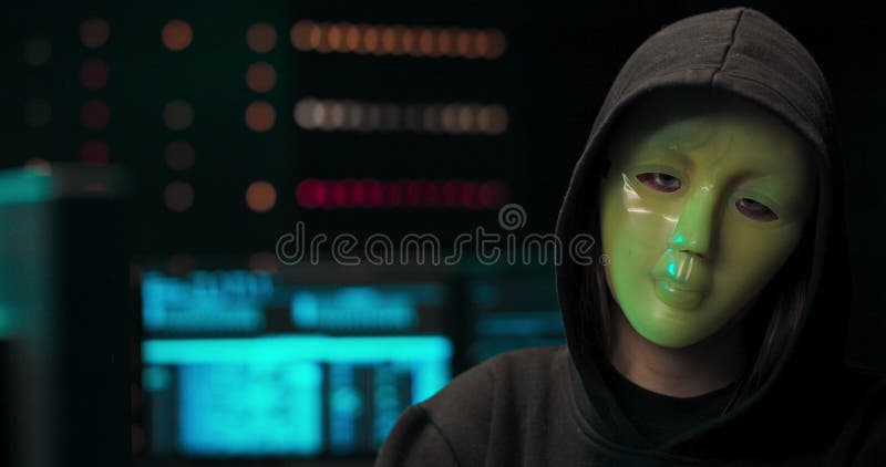 Dangerous Internationally Wanted Hacker with Masked Face Speaks into ...