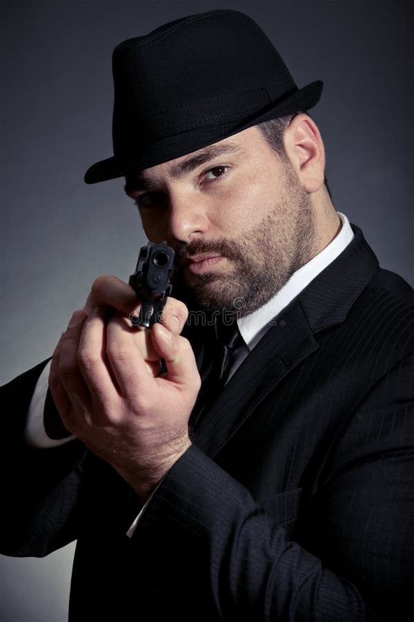 Dangerous man with a gun stock photo. Image of dude, clothes - 23259706