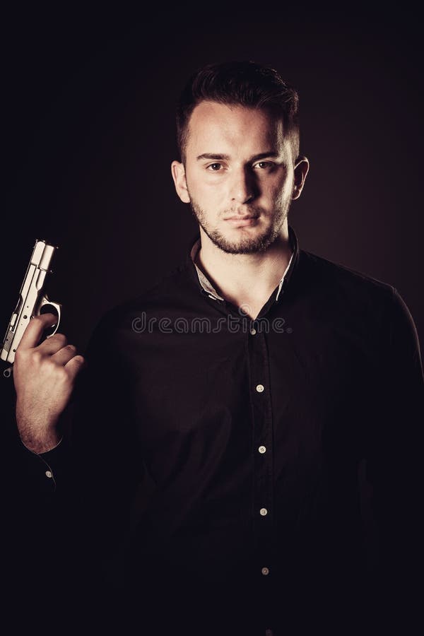 Dangerous man with a gun stock photo. Image of aiming - 64370910