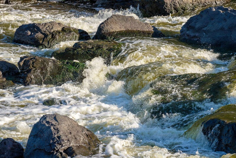 Dangerous Rocks and Fast Flowing River with Splashes Stock Photo ...