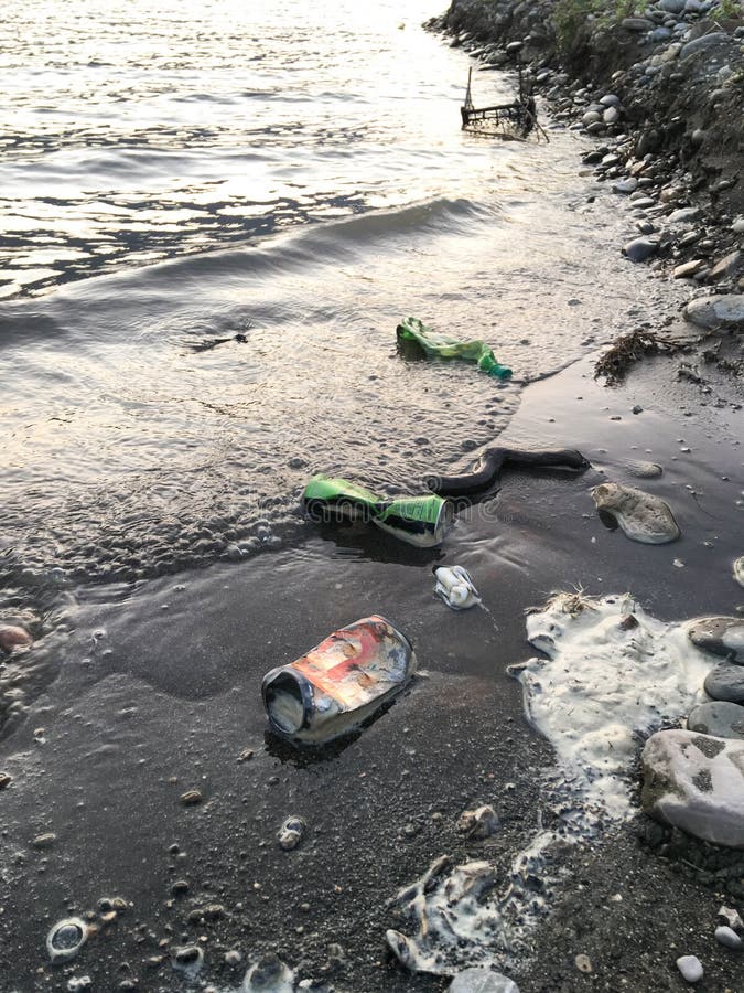 Dangerous Rubbish on a Stony Beach. Photo Showing Pollution Problem ...