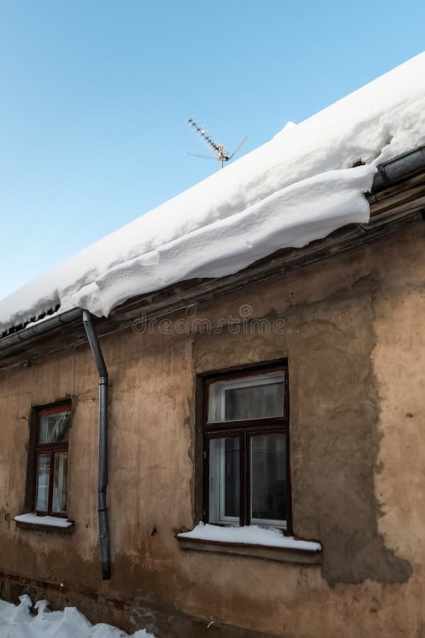 Dangerous Snow Falls from the Roofs of the Buildings. Winter with Heavy ...