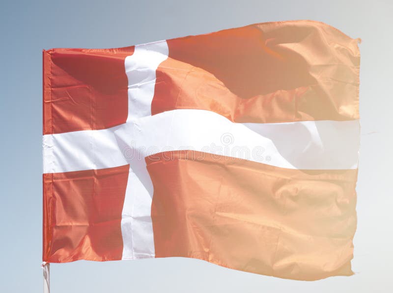 Danish Flag with Blue Sky in the Background Stock Photo - Image of ...
