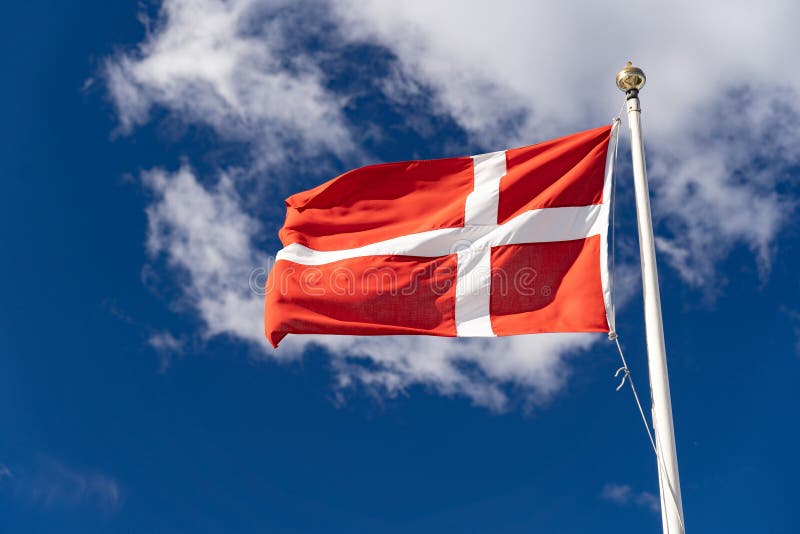 Danish Flag Isolated on the Blue Sky with Clouds. Close Up Waving Flag ...