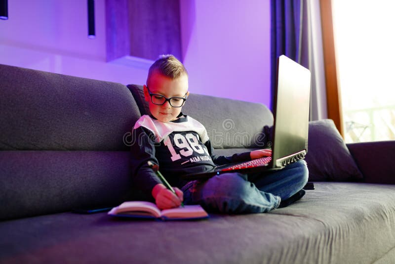 Danya& X27;s Boy Studies at Home on the Computer. Stock Photo - Image ...