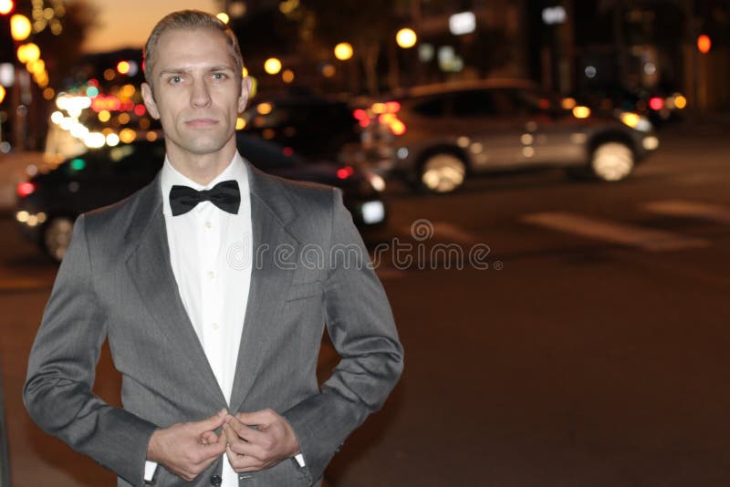 Dapper Gentleman Outside at Night in the City Looking Away while ...