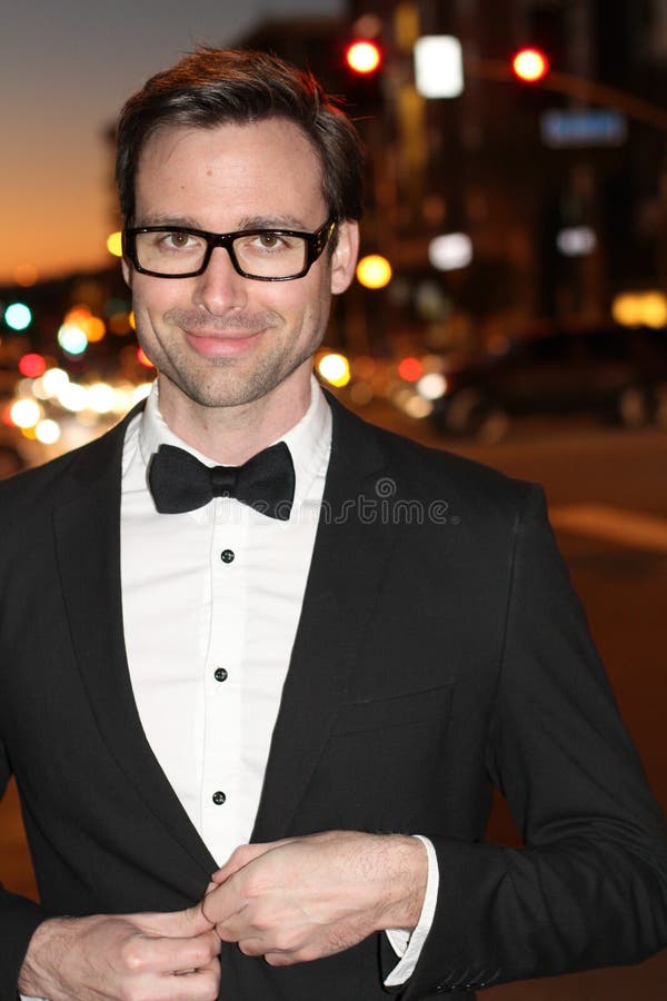 Dapper Gentleman Outside at Night in the City Looking Away while ...