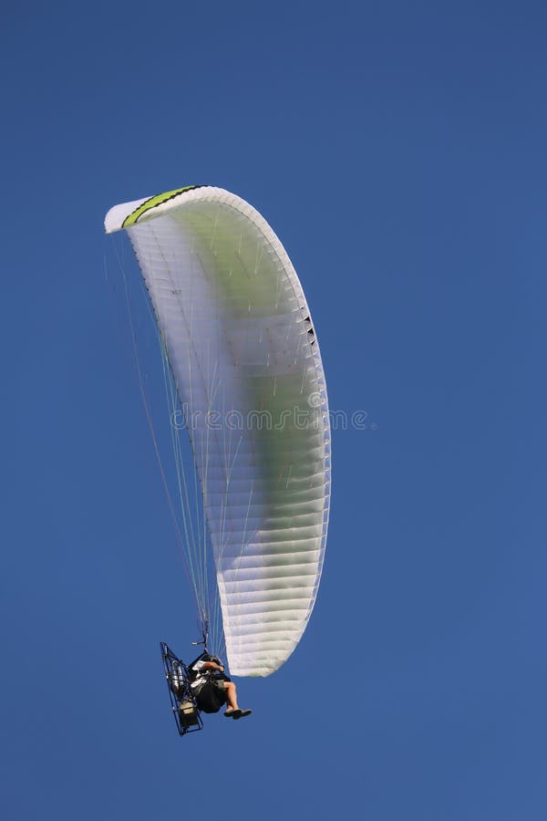 Daredevil Pilot with the Motor Glider Flies Fast in Blue Sky Stock ...