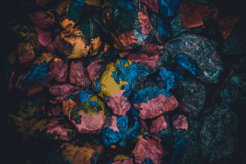 Dark Abstract Background of Stones Covered with Multi-colored Paint ...