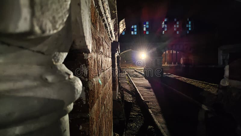 A Dark Arch in an Ancient Fortress or Castle at Night and the Light of ...
