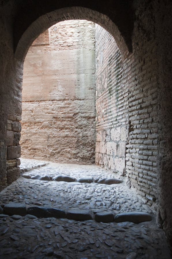 Dark arch walkway stock photo. Image of exploring, bricks - 14757288