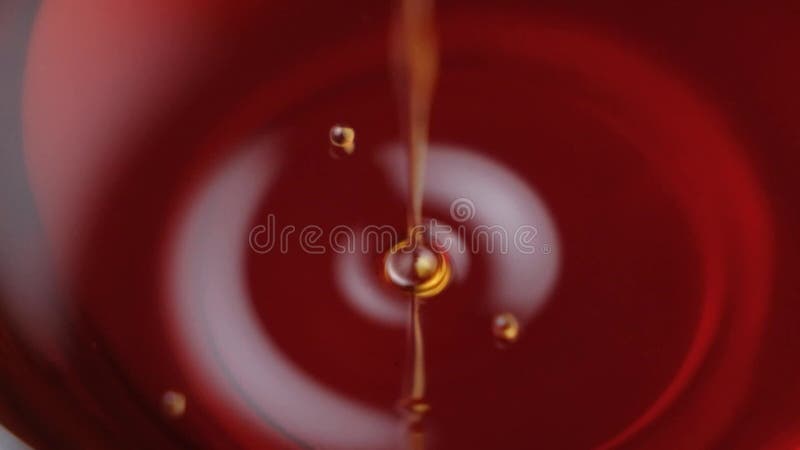 Dark Aromatic Oil Pouring, Bubbles, Slow Motion Macro Stock Footage ...