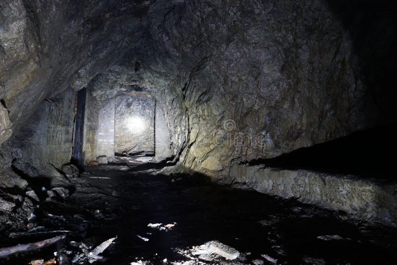 A Dark Artificial Stone Cave in the Mountains. Stock Image - Image of ...