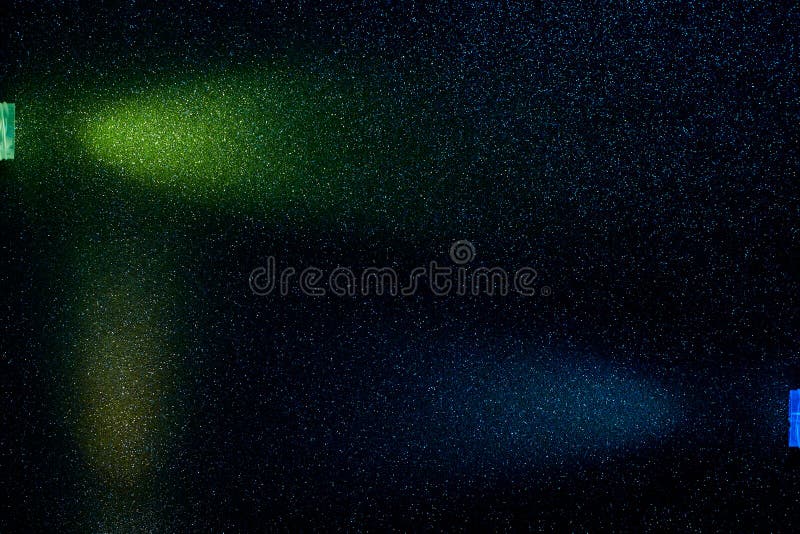 On a Dark Background in a Small Multi-colored Grain, Rays of Light ...