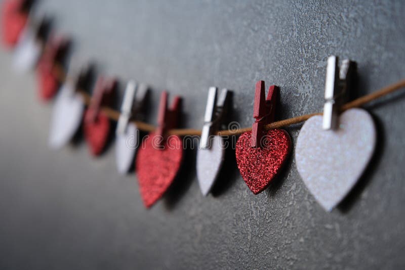 On a Dark Background on a String of Hearts Stock Image - Image of star ...