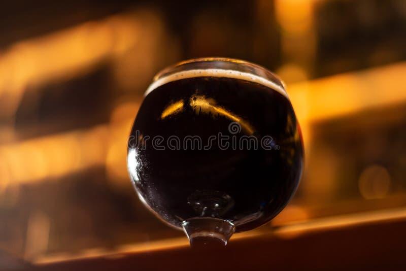 Dark Craft Beer on Wooden Bar Table Close Up with Blurred Background ...