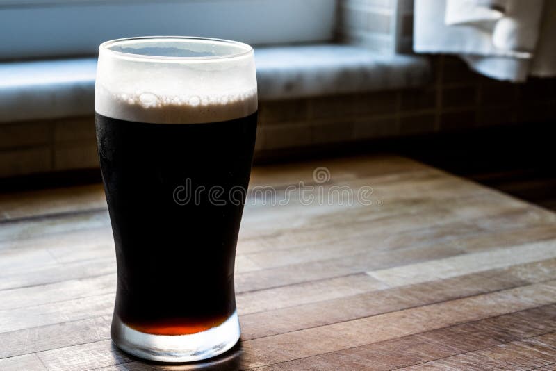 Dark Beer at Kitchen on Wooden Surface. Stock Image - Image of pint ...