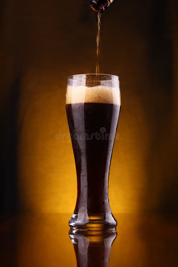 Dark beer pouring stock photo. Image of brewing, glass - 42409892