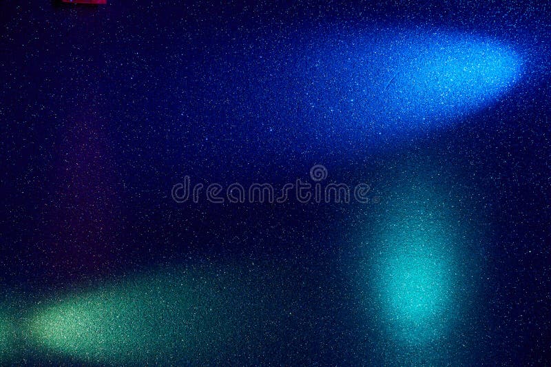 On a Dark Blue Background in Fine Grain Multidirectional Gradient Rays ...