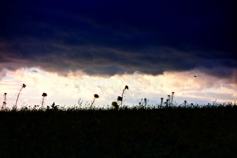 Dark Blue Brooding Sky after a Storm with a Helicopter in the Clouds ...