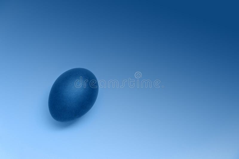 Dark Blue Egg on a Large Sky Blue Background. Classic Blue Background ...
