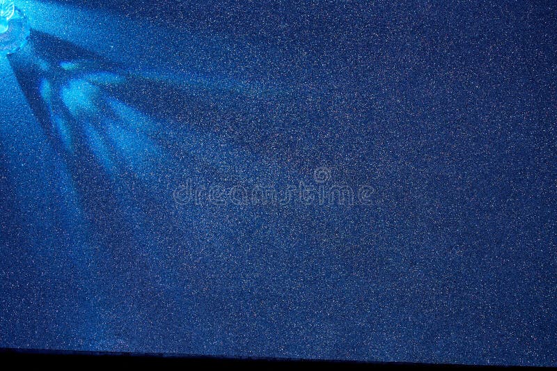 On a Dark Blue Gradient Background, Scattered Light Blue Rays of Light ...
