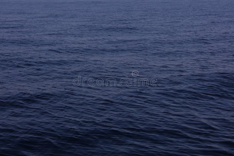 Deep blue ocean surface stock photo. Image of maritime - 235033020