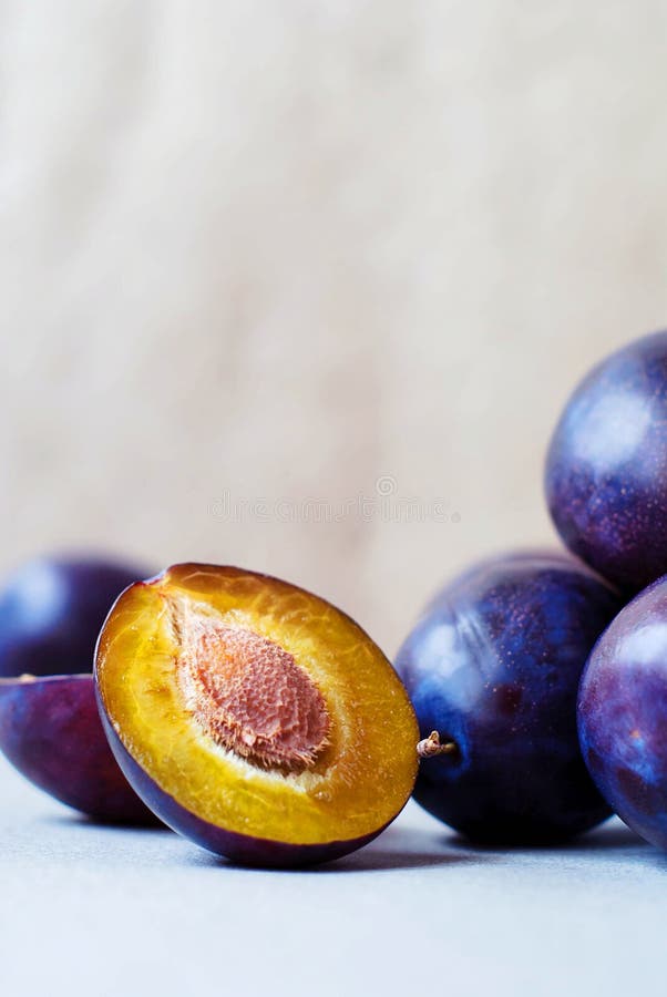 Dark Blue Plums on a Light Background. Stock Image - Image of purple ...