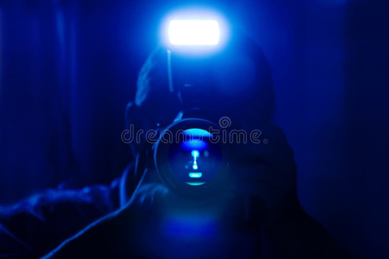 Dark blue self portrait stock image. Image of self, flash - 10889127