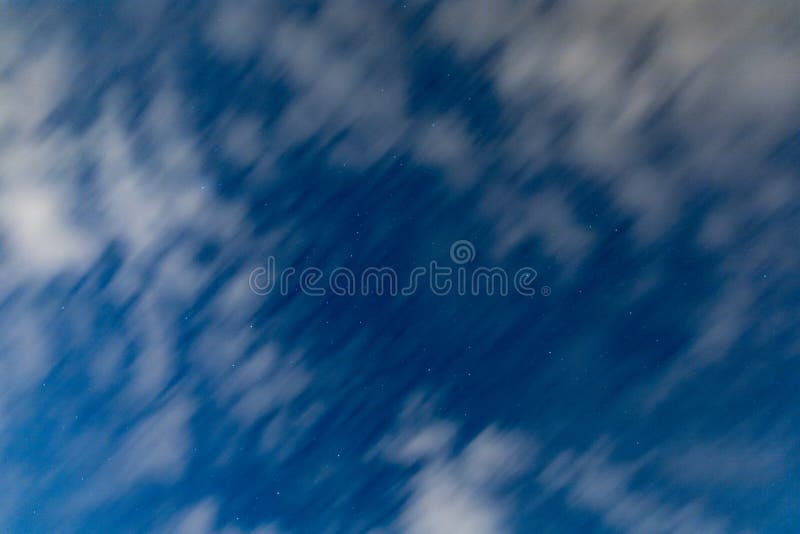 Dark Blue Sky on Long Exposure with Moving Clouds at Night Stock Photo ...