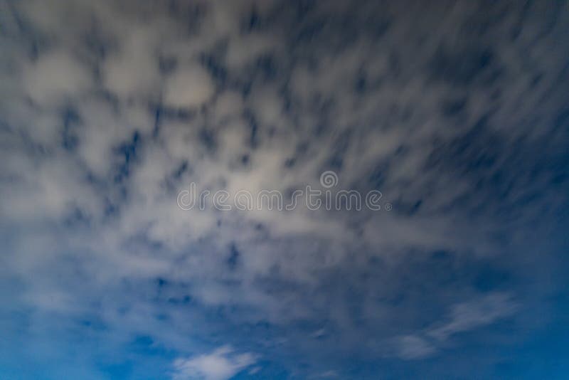 Dark Blue Sky on Long Exposure with Moving Clouds at Night Stock Photo ...