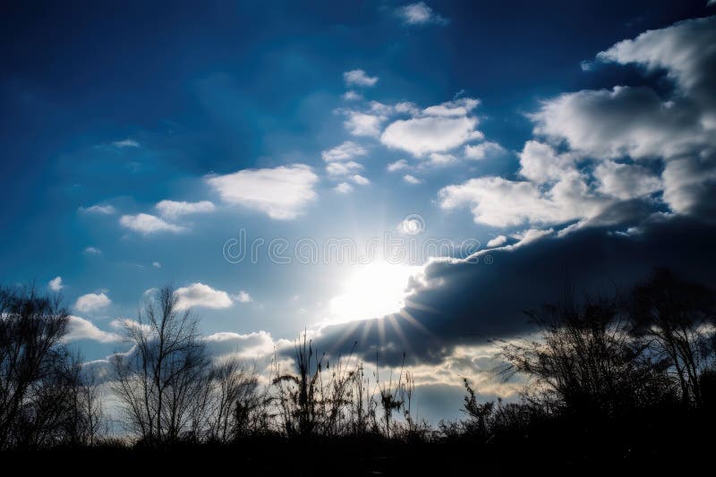 Dark Blue Sky with Wispy Clouds and Sun Shining through Stock ...