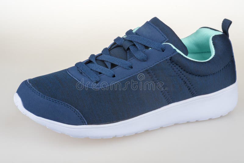 Dark Blue Snickers with a White Sole Stock Image - Image of female ...