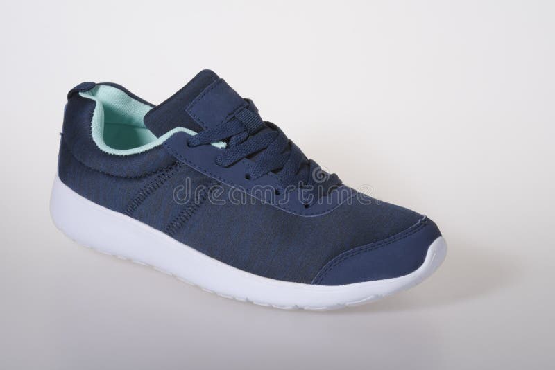 Dark Blue Snickers with a White Sole Stock Image - Image of style ...