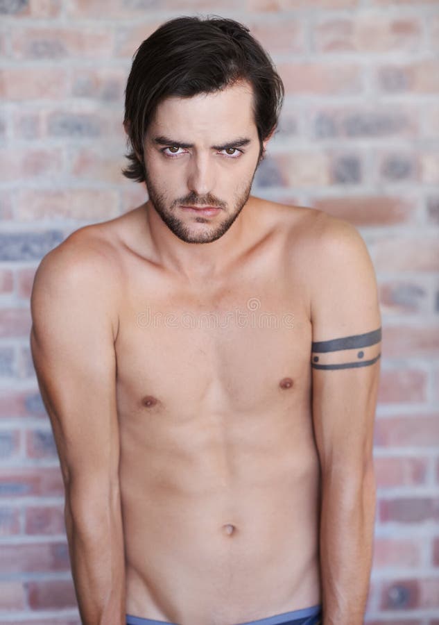 Dark and Brooding. Portrait of a Handsome Shirtless Man Looking Serious ...