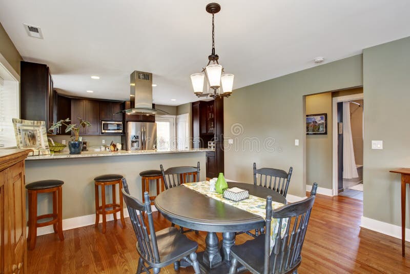 Dark Brown Kitchen Room with Dining Area Stock Image - Image of ...