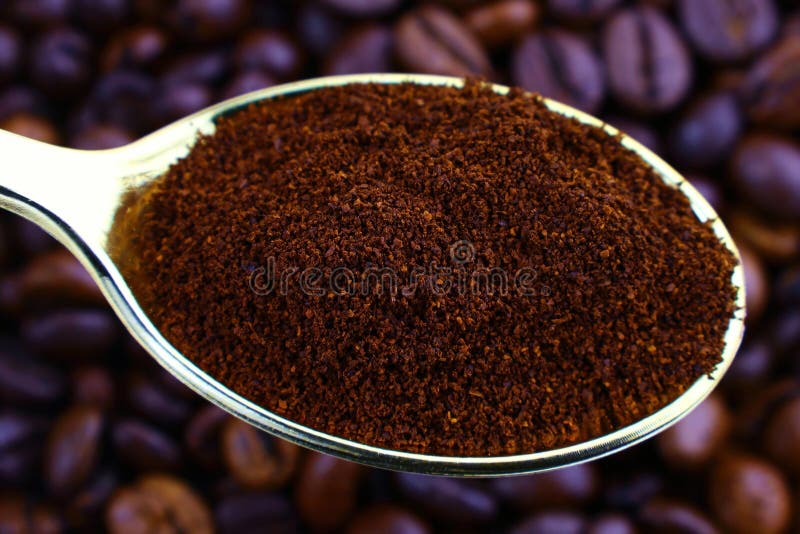 Dark Brown Roasted Coffee Beans and Ground Coffee Powder in Spoon Stock ...