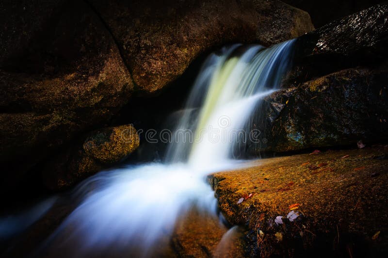 Dark Brown Waterfall in the Middle of a Hidden Forest with Glass Stones ...