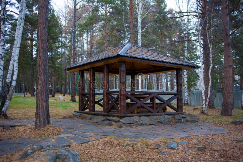 A Dark Brown Wooden Gazebo for Relaxing in the Forest Stock Photo ...