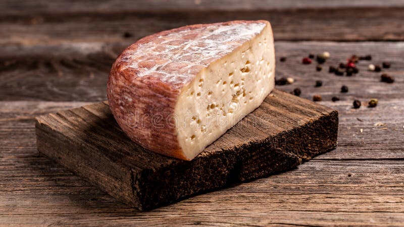 Dark Cheese Soaked in Wine and Traditional. on Rustic Wooden Table ...