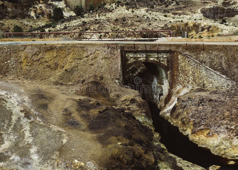 Dark Chemical River Going through the Bridge Under the Mine Stock Photo ...