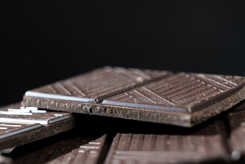 Dark Chocolate Bar Close-Up on Black Background Stock Photo - Image of ...